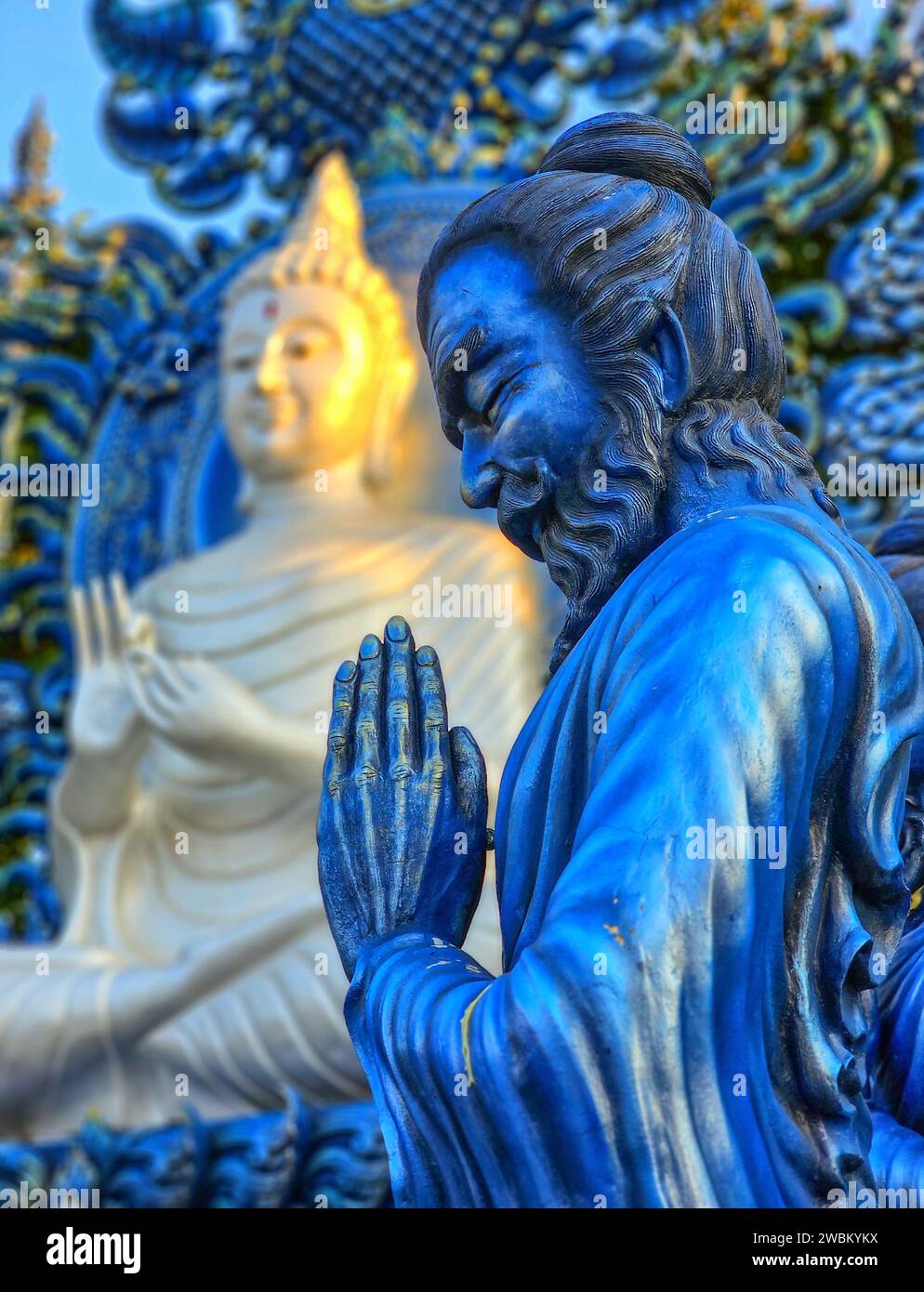 Praying monk statue at Wat Rong Suea Ten Blue temple, Chiang Rai ...