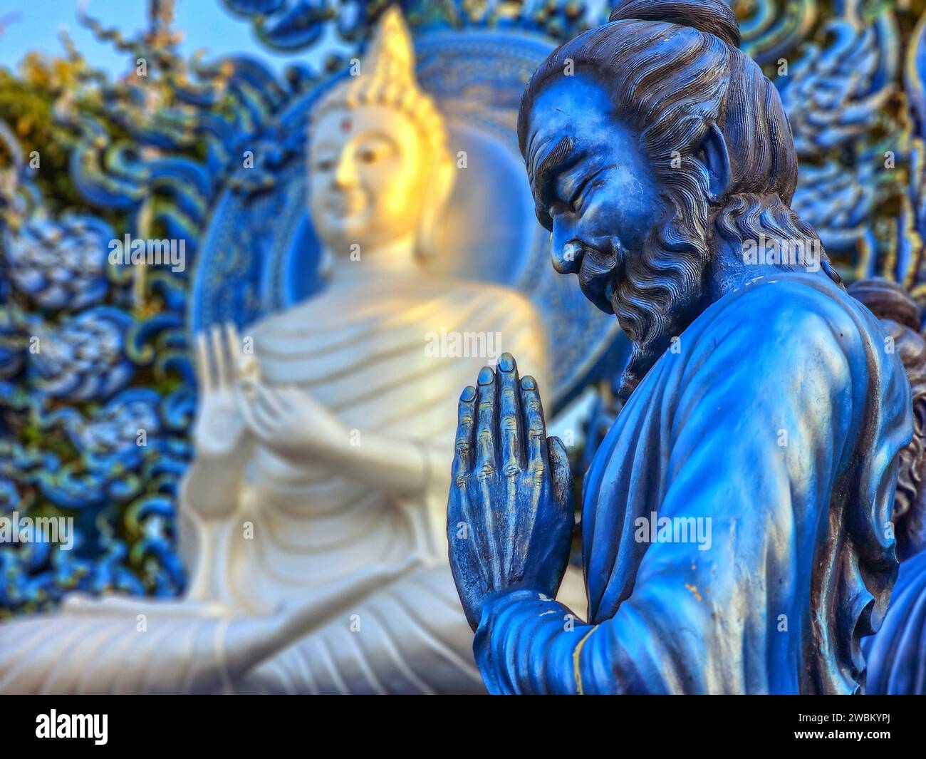 Praying monk statue at Wat Rong Suea Ten Blue temple, Chiang Rai ...
