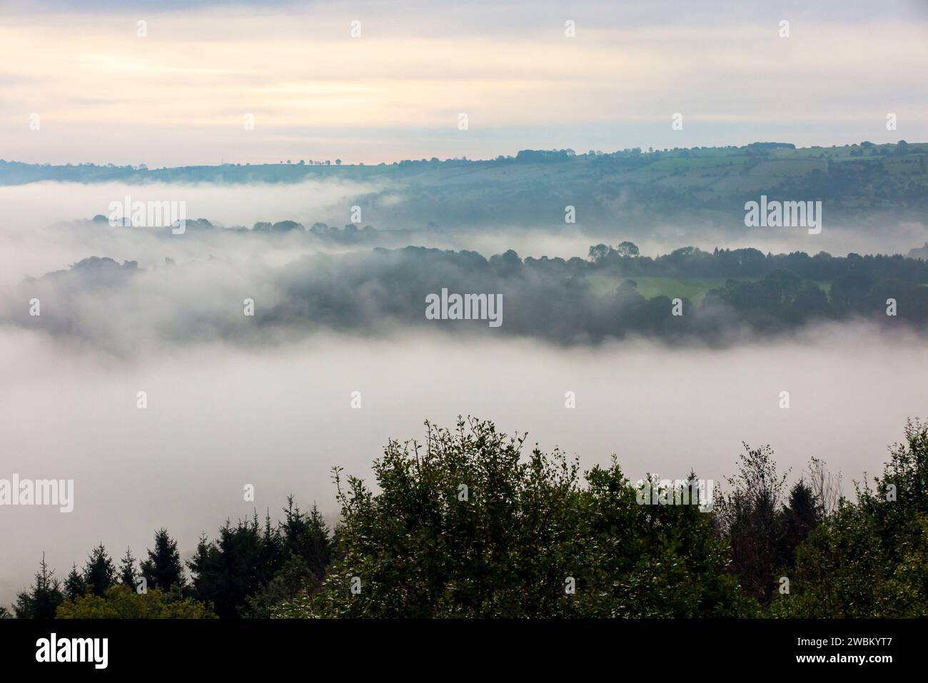 View south from Stanton Moor over misty landscape caused by cloud ...
