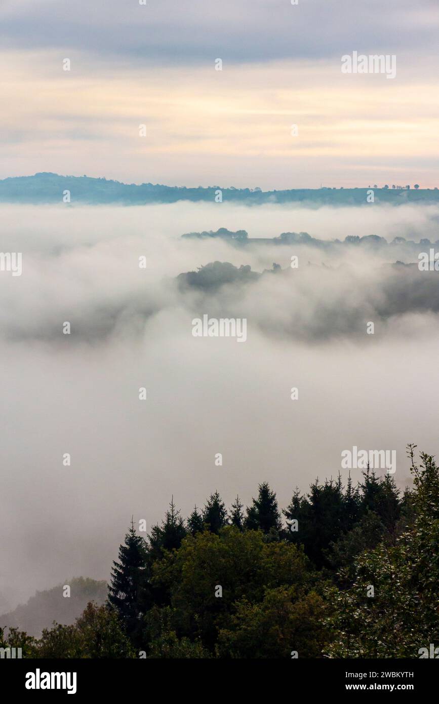 View south from Stanton Moor over misty landscape caused by cloud ...