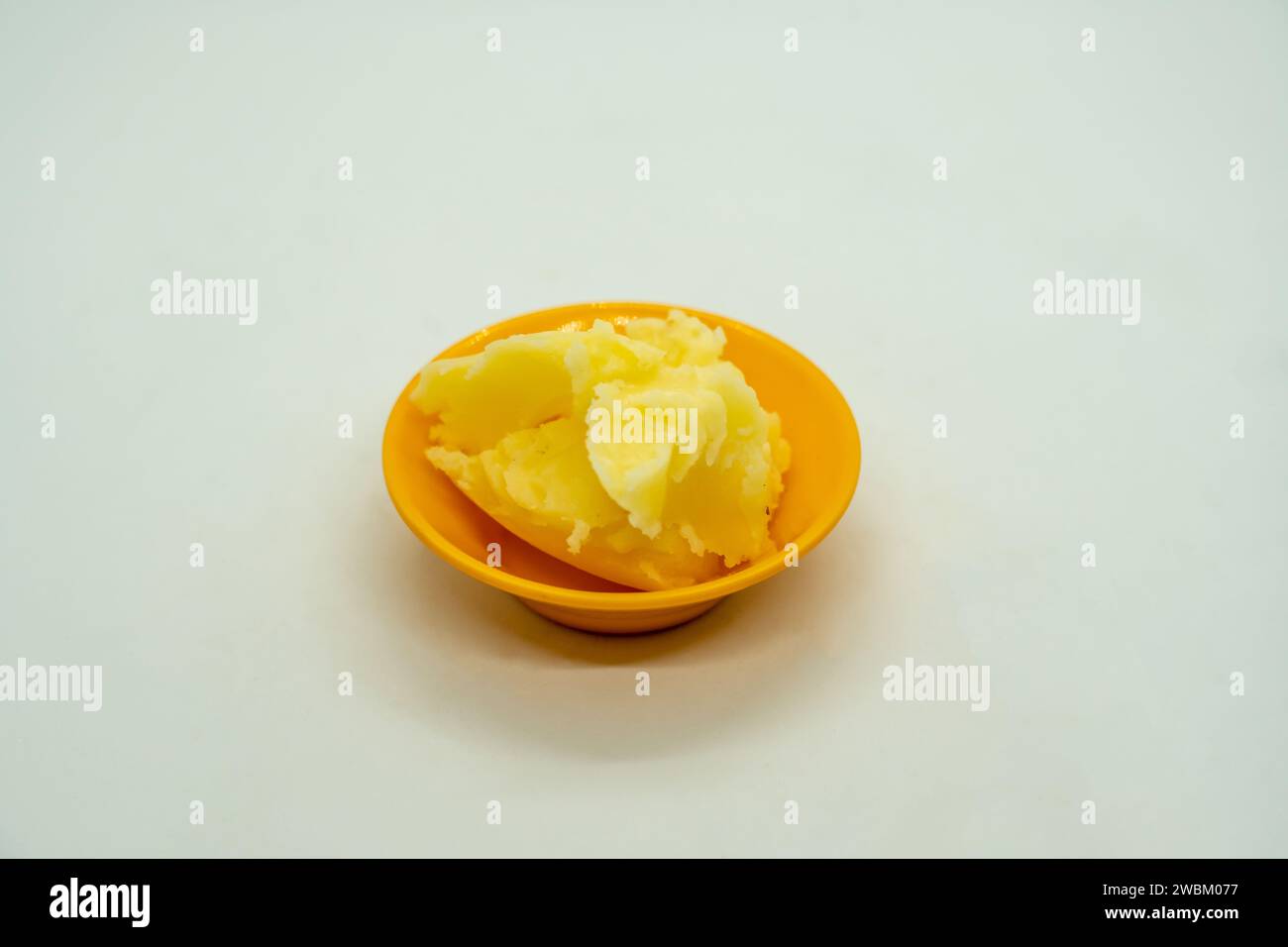 Small bowl of Yak Cow Ghee from the Himalayas of Nepal Stock Photo - Alamy