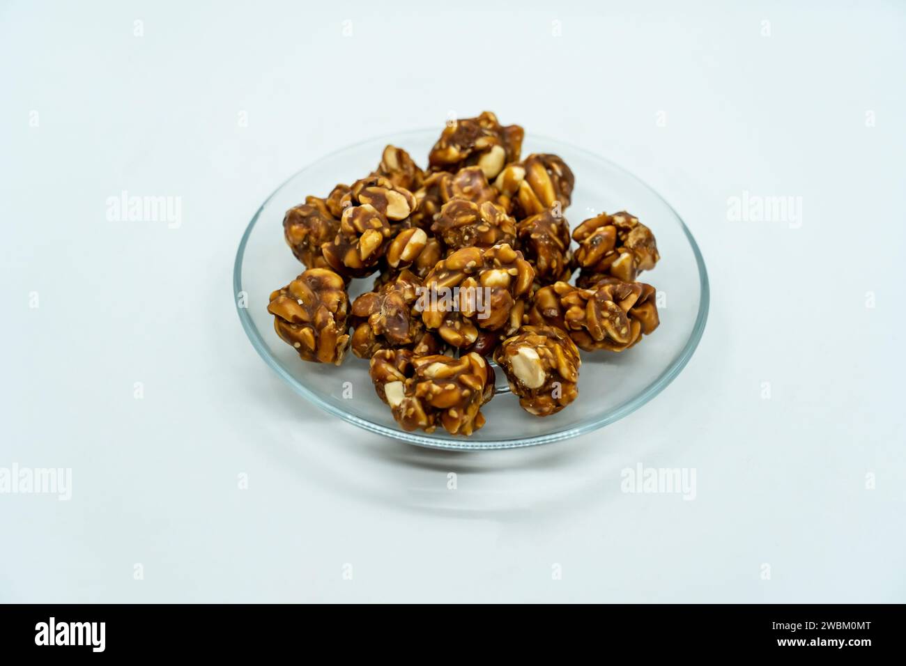 A Plate of Peanut Ladoo for Makar Sankranti which is Peantus dipped in ...