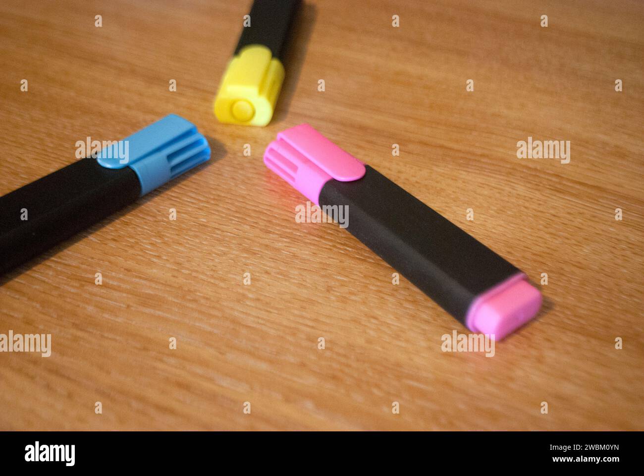Two rubik's cubes on a desk Stock Photo - Alamy