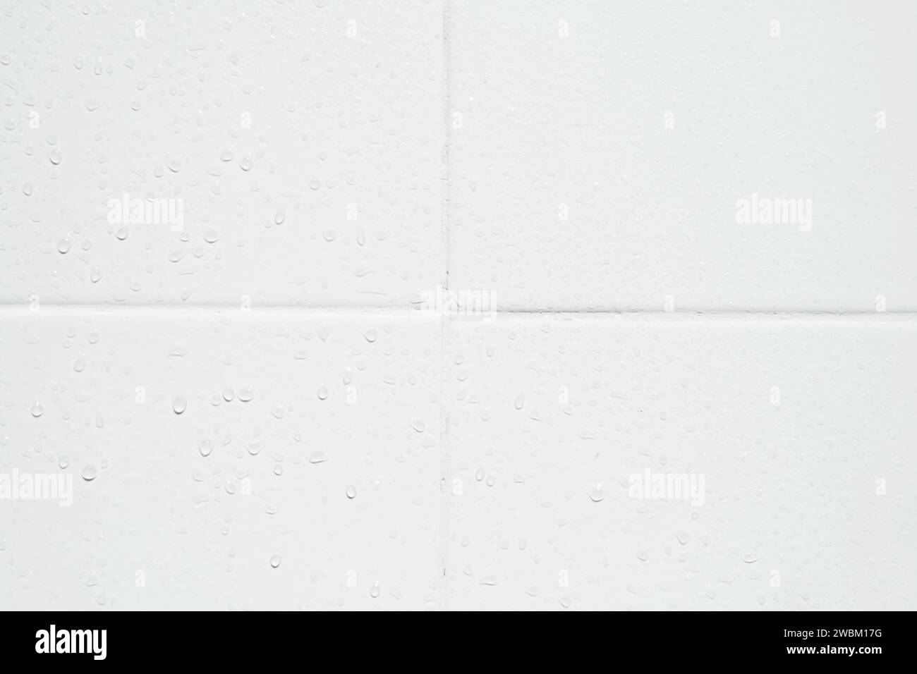 drop of water on white tiles wall texture background Stock Photo - Alamy