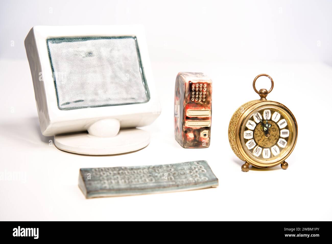 an old golden analog alarm clock with mechanical movement isolated on a ...