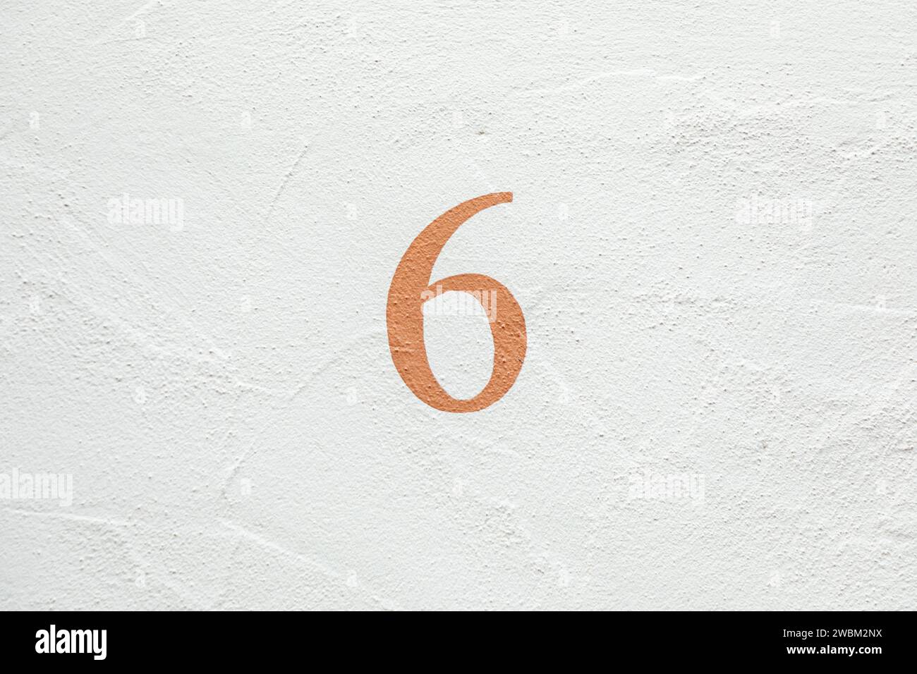 house number 6 at a harmonic white painted wall Stock Photo - Alamy