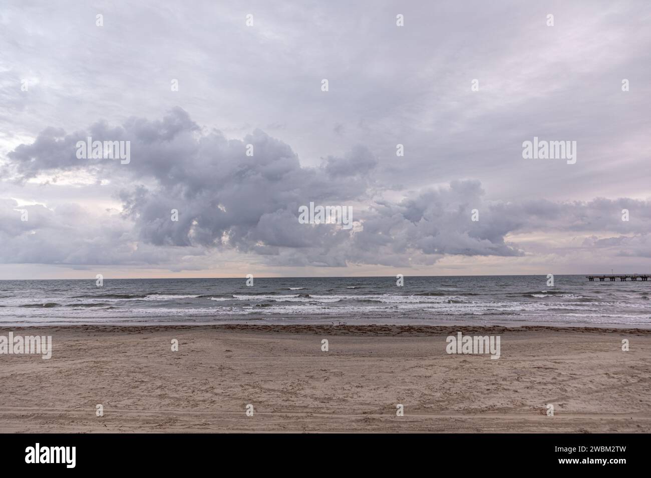 dark clouds at the sandy beach in Galveston, Texas, USA Stock Photo - Alamy