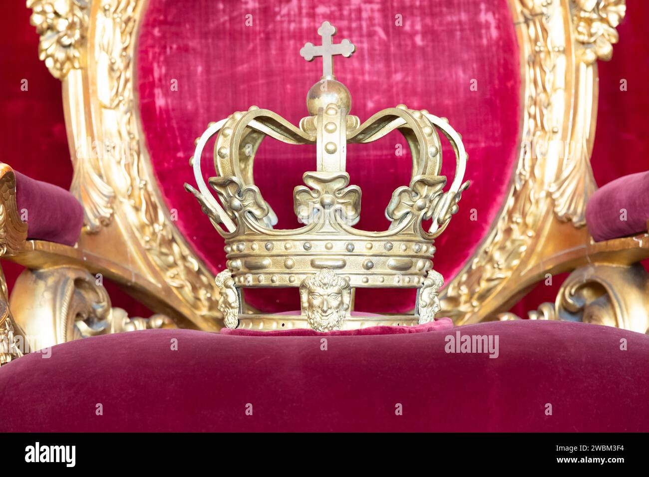 Ancient crown on red velvet. Antique symbol of authority, luxury ...