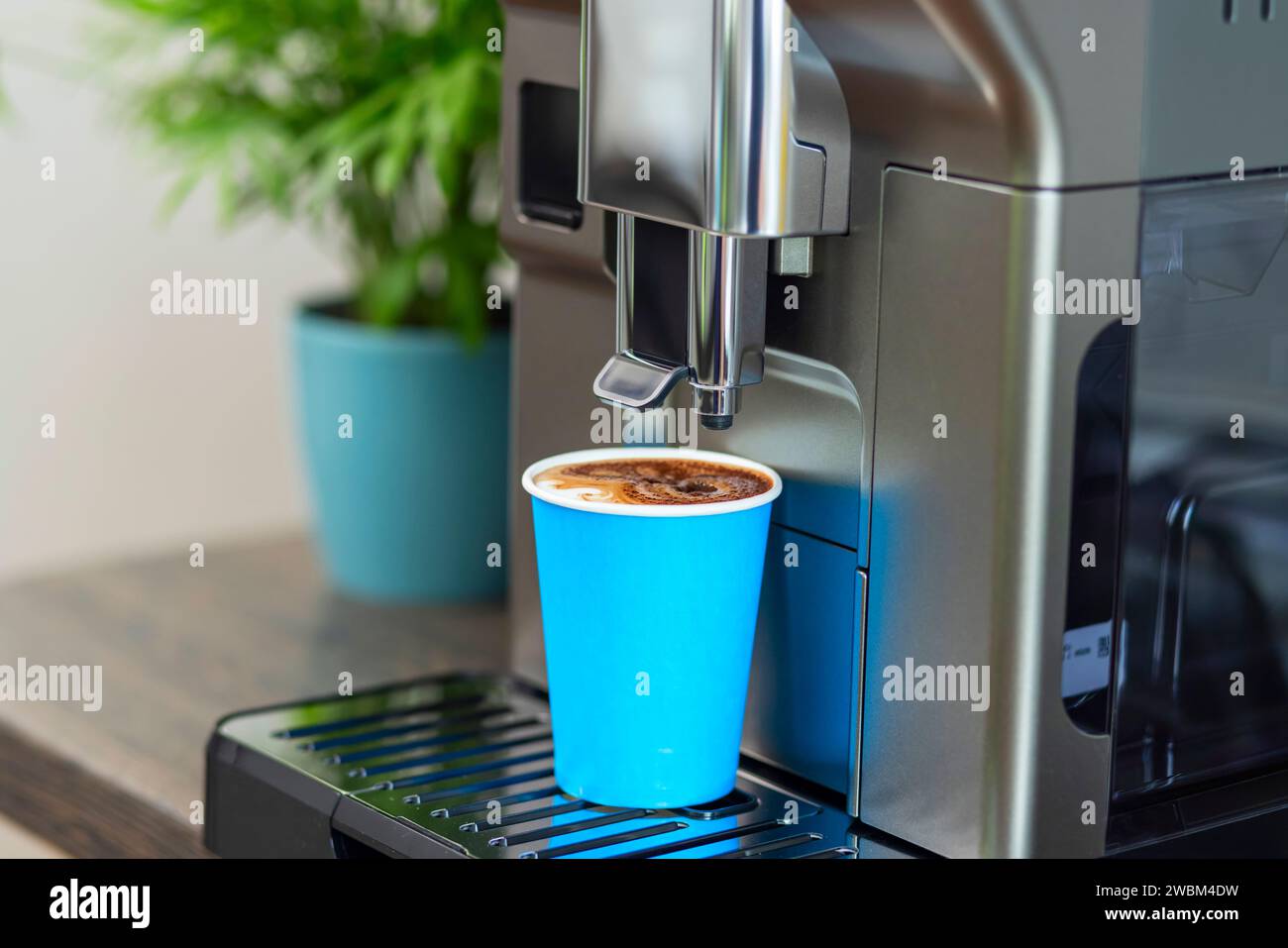Automatic Coffee Machine Dispensing Espresso into Cup Stock Photo - Alamy