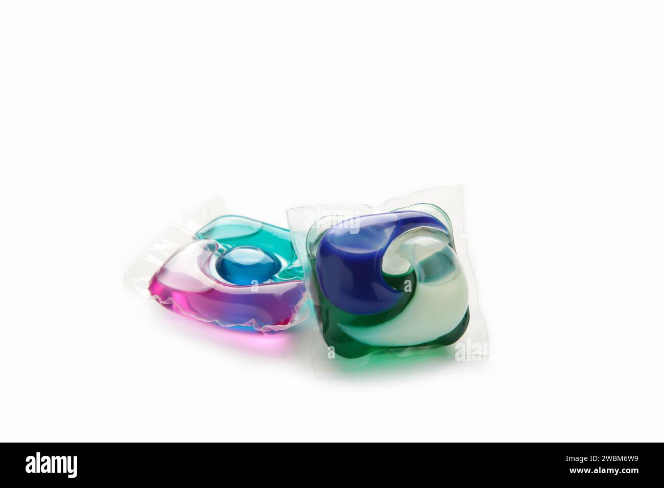 Laundry capsule detergent pods for washing clothes isolated on white ...