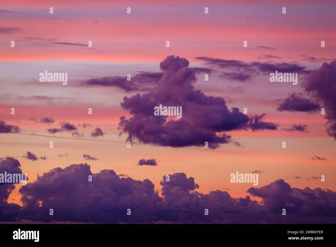 Ethereal sky painted in soft shades of pink and purple as the sun sets ...