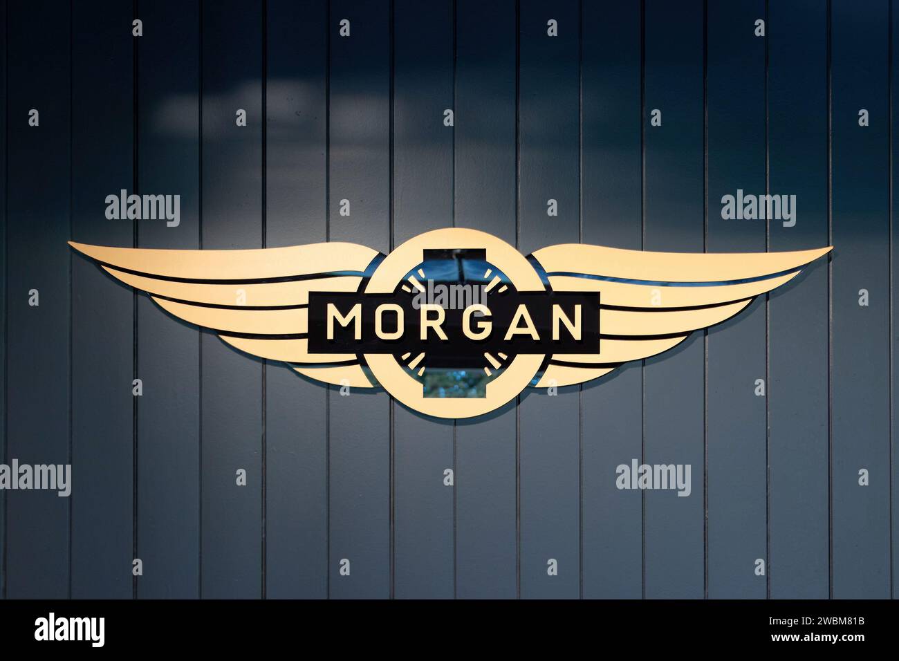 isolated morgan logo badge or emblem on wall at the morgan car factory ...