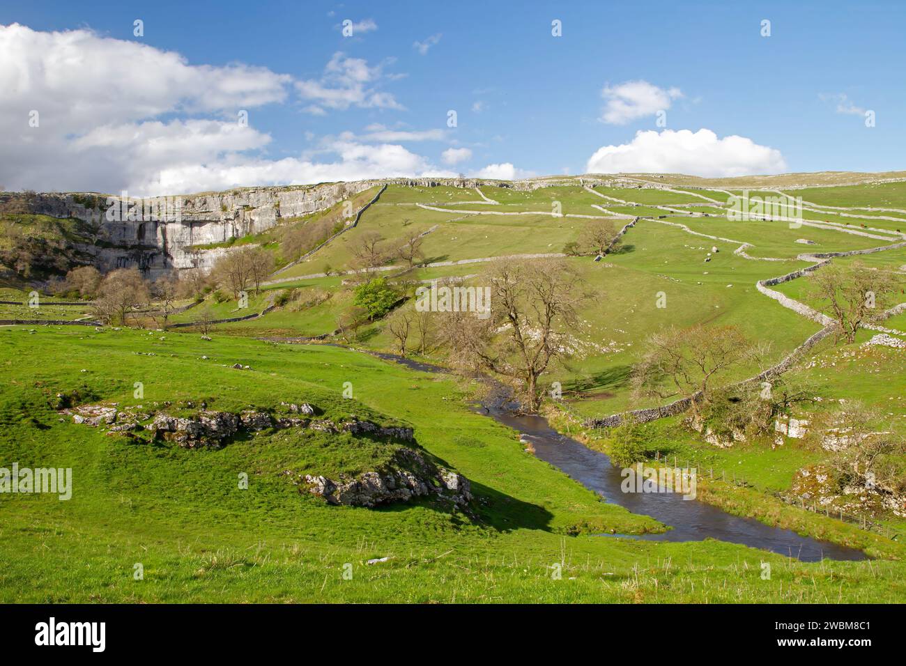 Nice scenic view of Malham Cove featuring river and hills with old ...