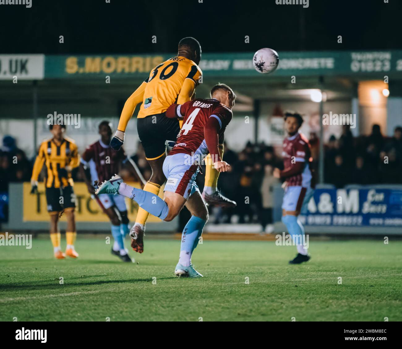 Frank Nouble goes for goal but Nick Grimes heads clear of goal Stock ...