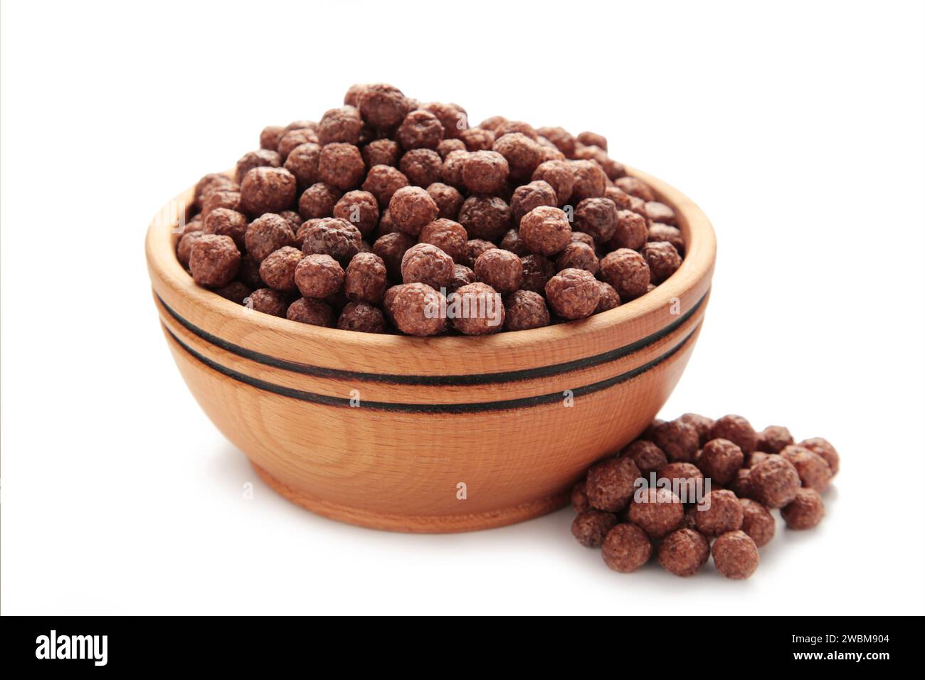 Chocolate corn balls in wooden bowl isolated on white background. Top ...
