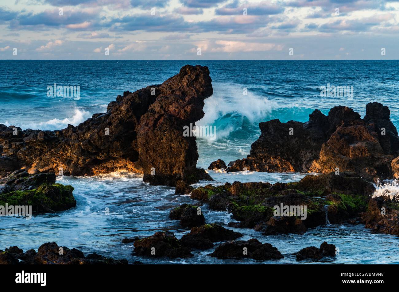 Mighty waves break on Ho'okipa's volcanic rocks, a testament to Maui's ...
