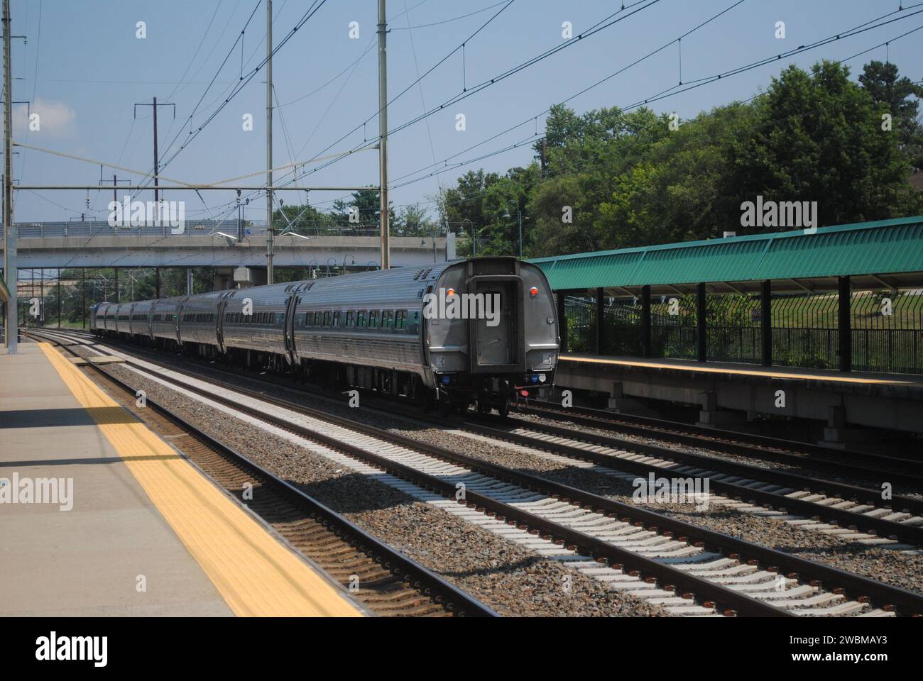 A photo of an Amtrak Northeast Regional train going through the Halethorpe, MD train station ...
