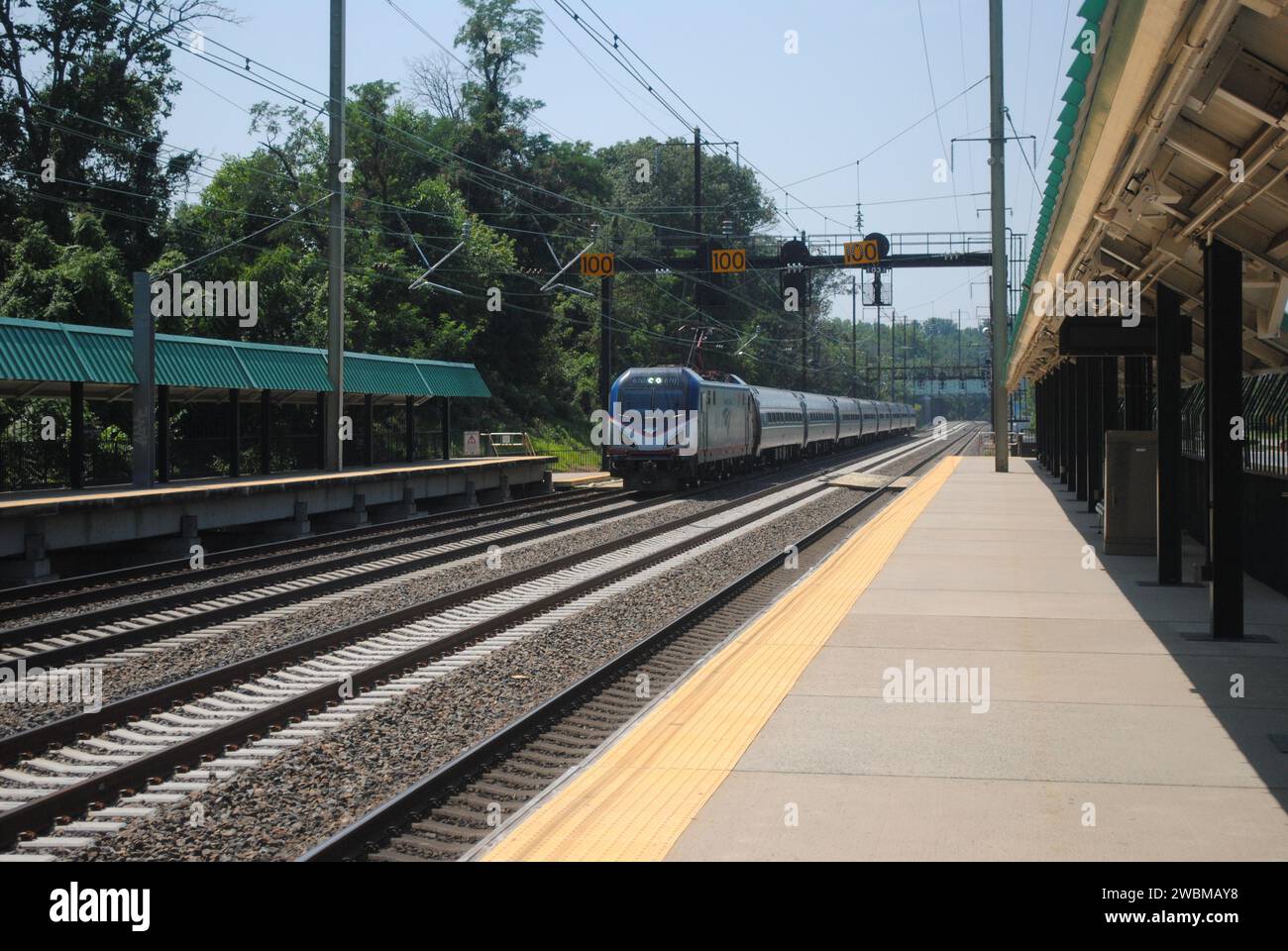 A photo of an Amtrak Northeast Regional train going through the Halethorpe, MD train station ...