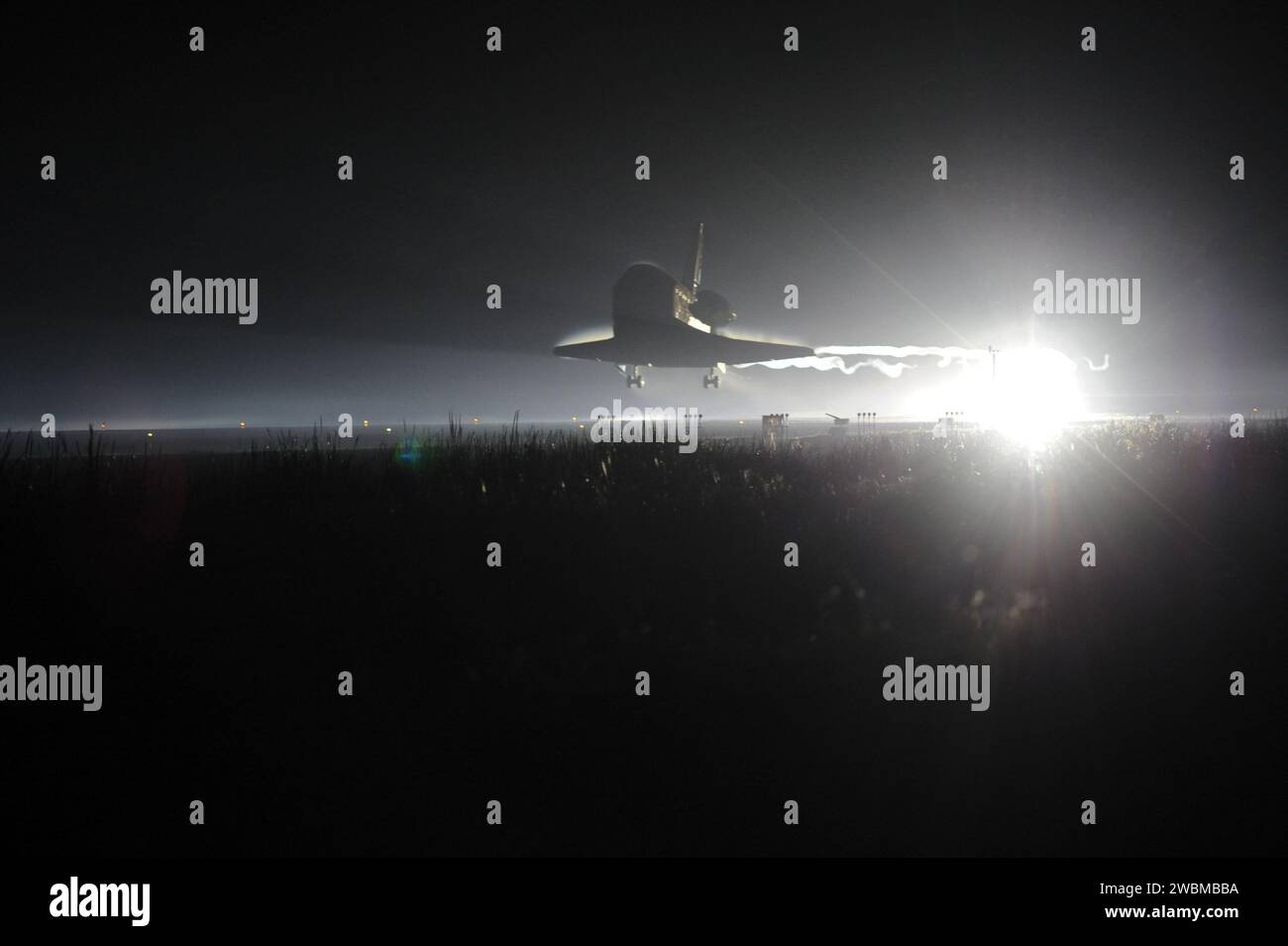 STS135-S-229 (21 July 2011) --- Ribbons of steam and smoke trail space ...