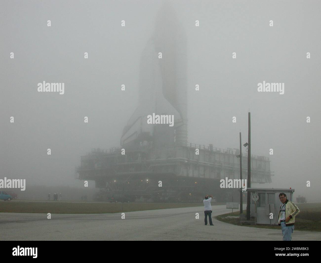 KENNEDY SPACE CENTER, Fla. -- Fog-enshrouded Space Shuttle Discovery ...