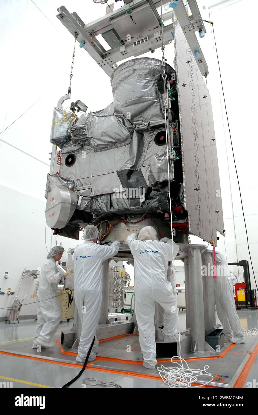 KENNEDY SPACE CENTER, FLA. - Astrotech in Titusville, Fla., Boeing technicians secure the GOES-N ...
