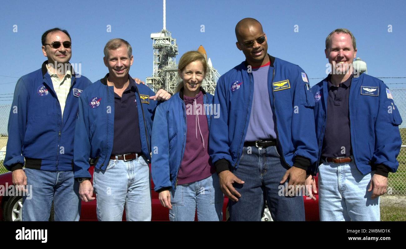 A happy and relaxed STS-98 crew pause for a photo at Launch Pad 39A one day before launch. From ...