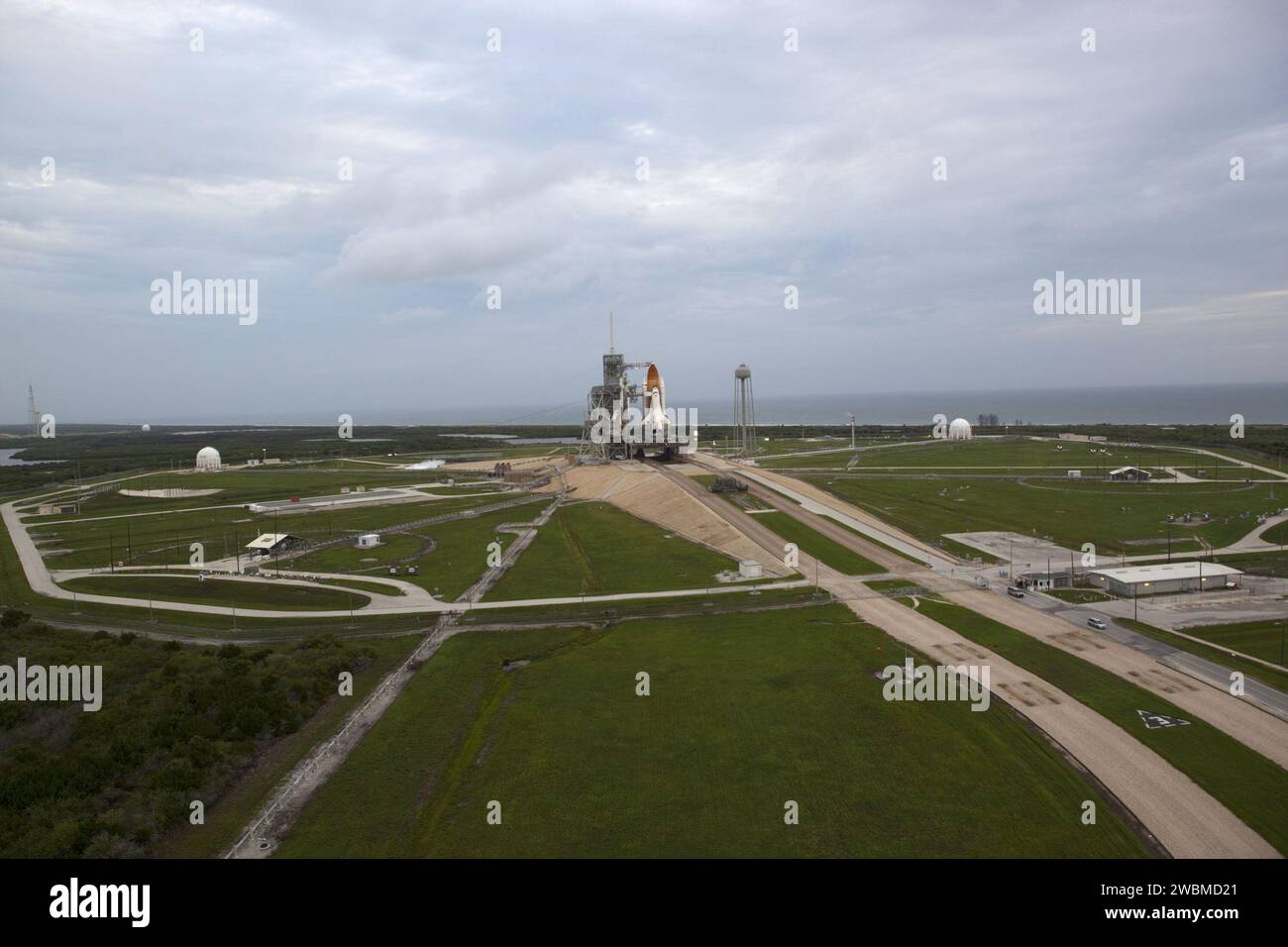Space Shuttle Atlantis is positioned on Launch Pad 39A at KSC with its ...