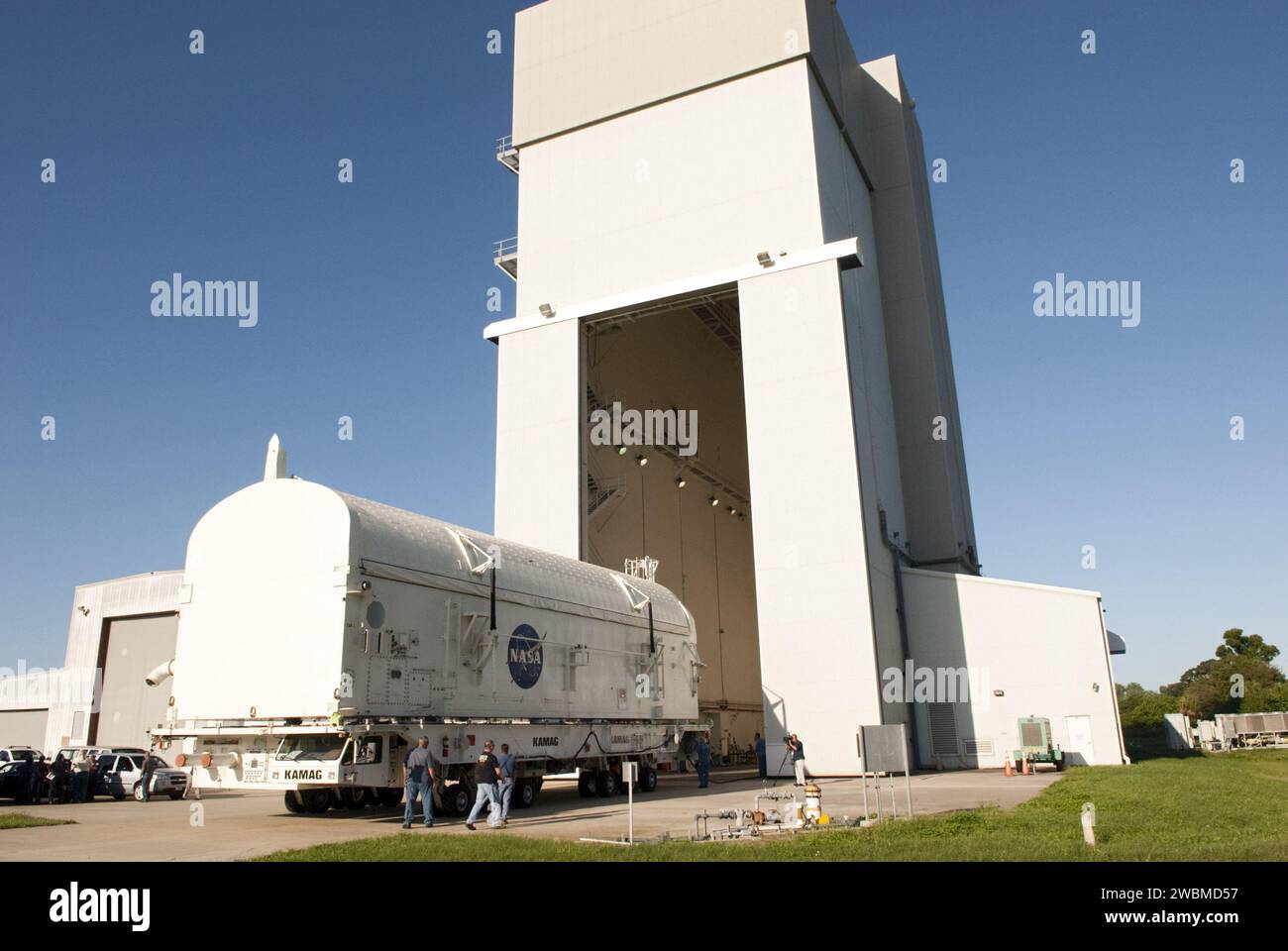CAPE CANAVERAL, Fla. -- Payload canister #1 departs the high bay of the ...