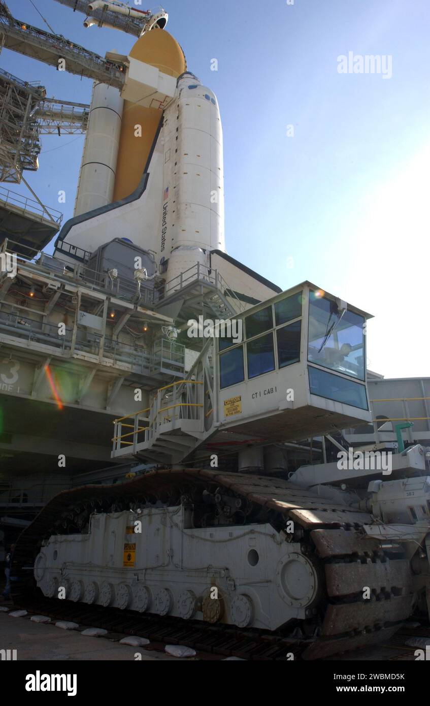 KENNEDY SPACE CENTER, Fla. -- The crawler-transporter (bottom) rolls ...