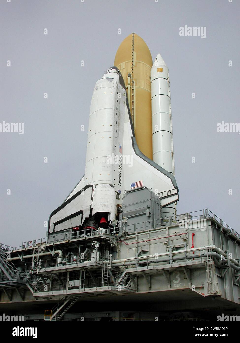 Space Shuttle Discovery is shown traveling to Launch Pad 39B at Kennedy ...