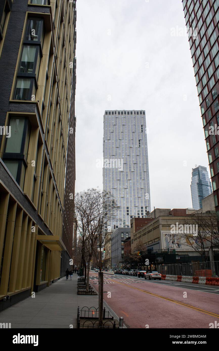 A view of a quiet city street, featuring two brick-fronted buildings on ...