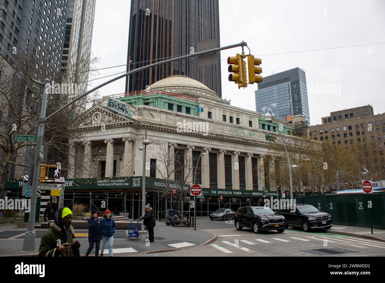 A view of a street corner illuminated by a green traffic signal ...