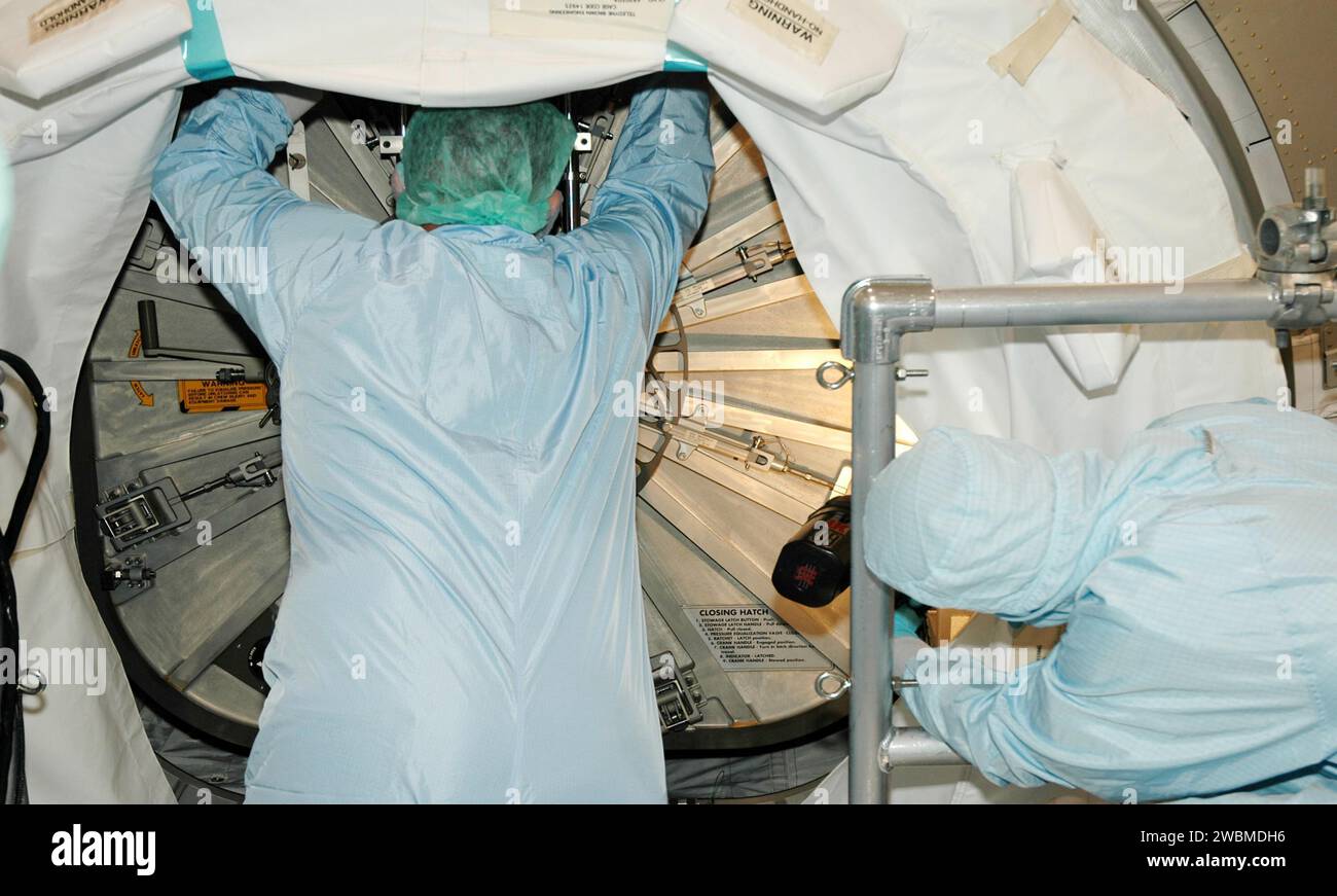 KENNEDY SPACE CENTER, FLA. -- Workers in the Space Station Processing ...