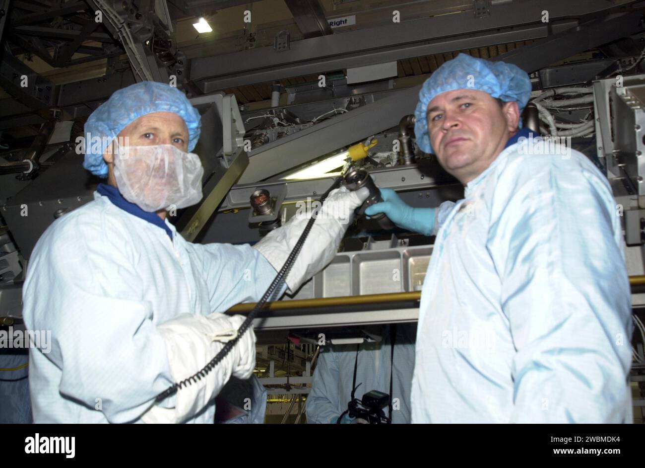KENNEDY SPACE CENTER, FLA. -- Members of the Expedition 6 crew look ...