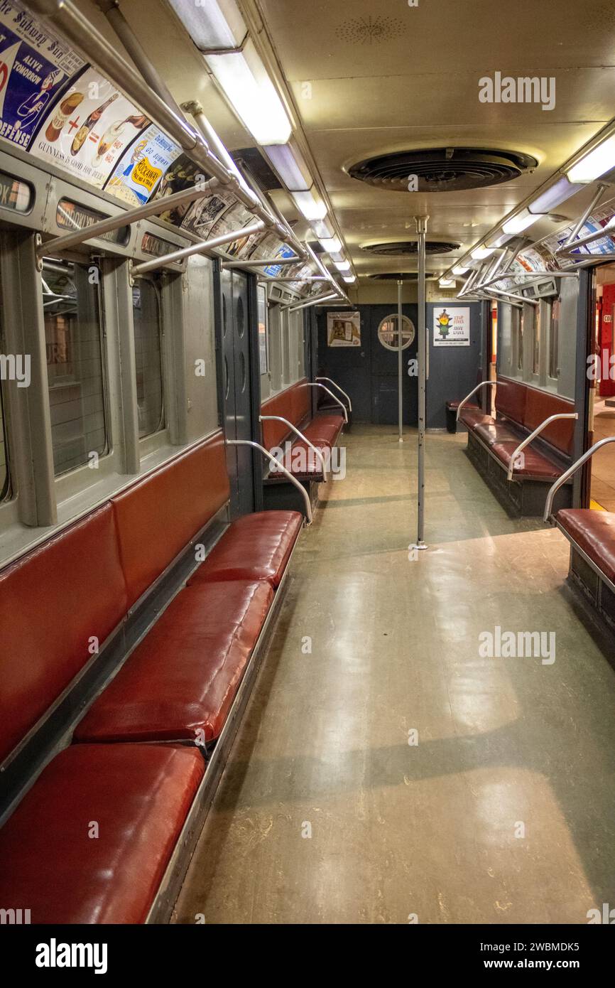 A close-up of an empty train seat surrounded by a full train of ...