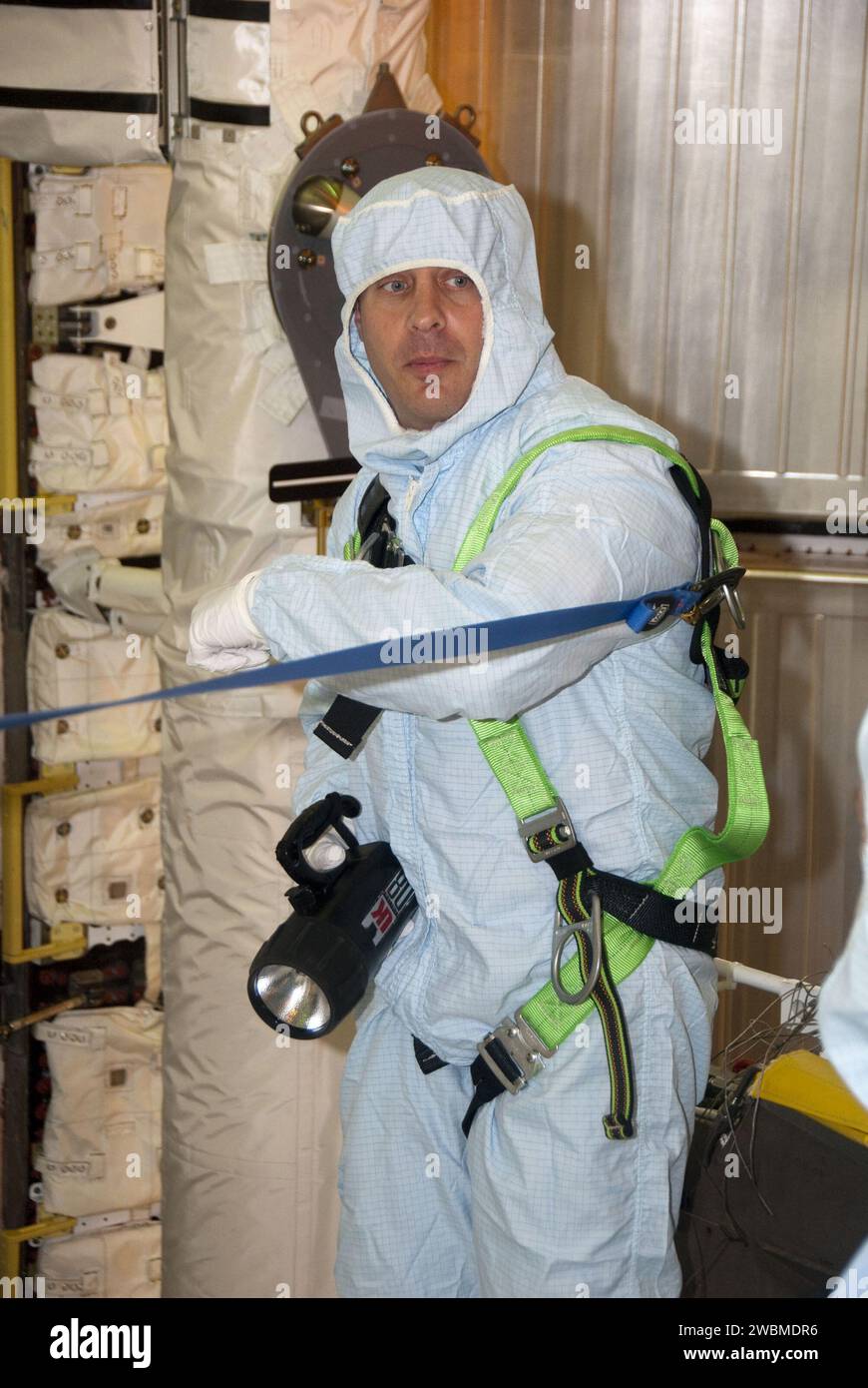At Launch Pad 39A, STS-132 Mission Specialist Garrett Reisman inspects ...