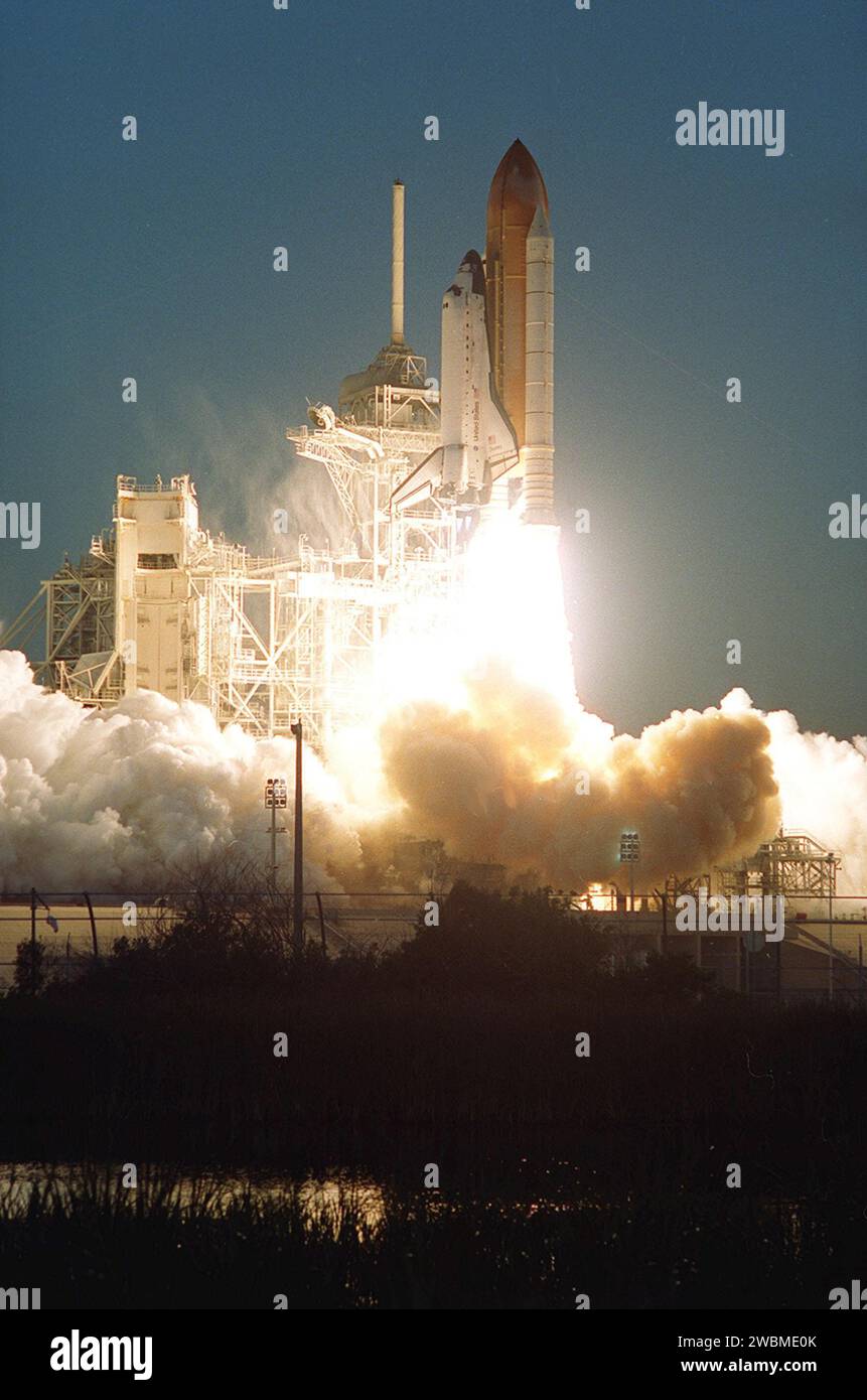 KENNEDY SPACE CENTER, Fla. -- Clouds of smoke and steam flow from Space ...