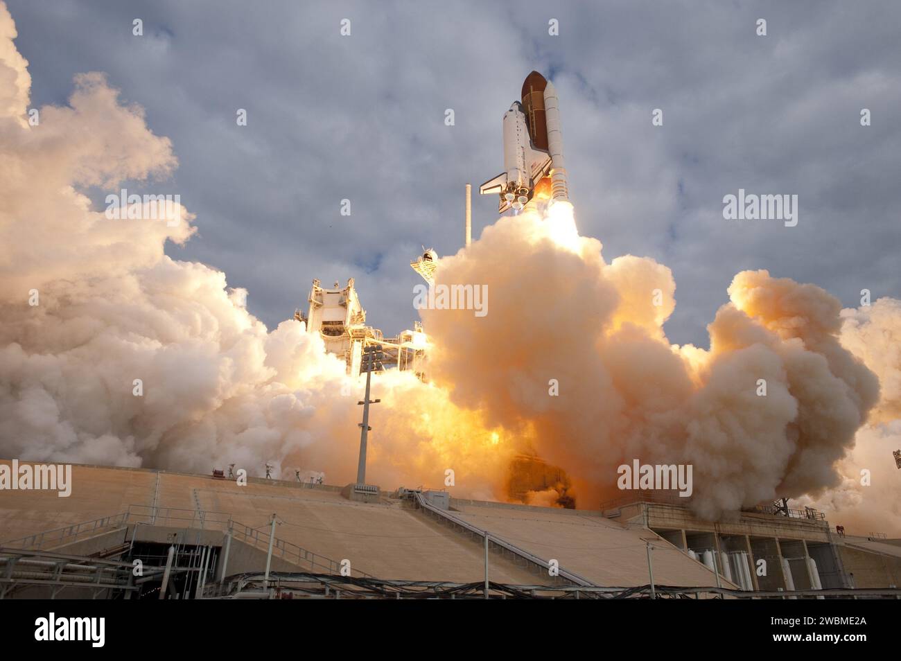 CAPE CANAVERAL, Fla. -- Space shuttle Endeavour rises through clouds of ...