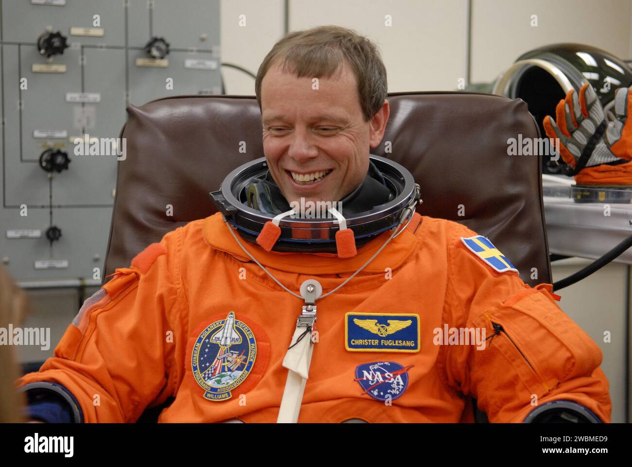 Crew members of STS-116 suit up at Launch Pad 39B aboard Space Shuttle ...