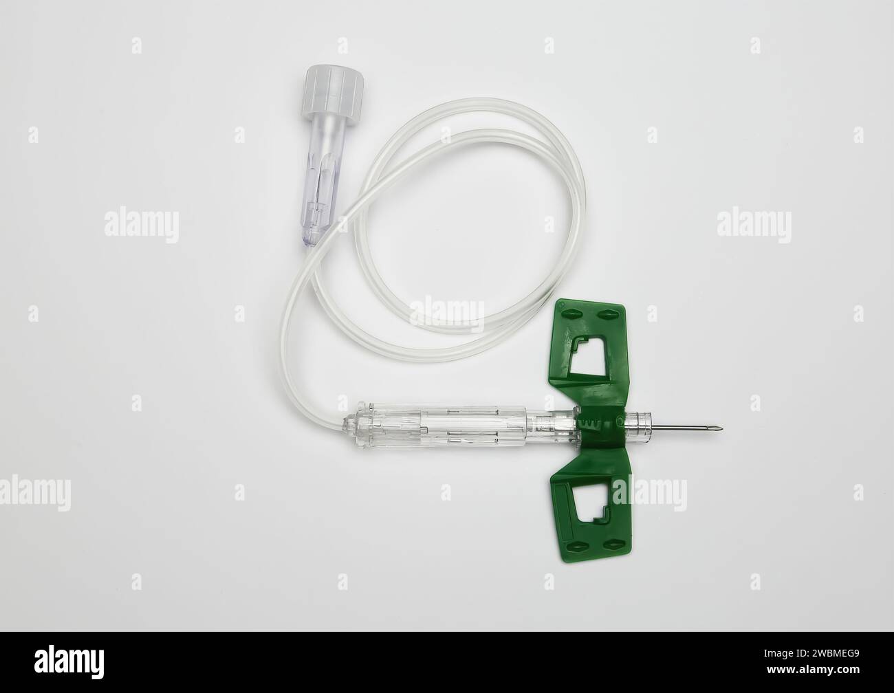 Closeup of one isolated butterfly safety winged IV needle with tube on ...