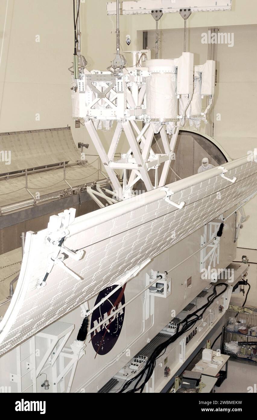 KENNEDY SPACE CENTER, FLA. - An overhead crane lowers the Hitchhiker ...