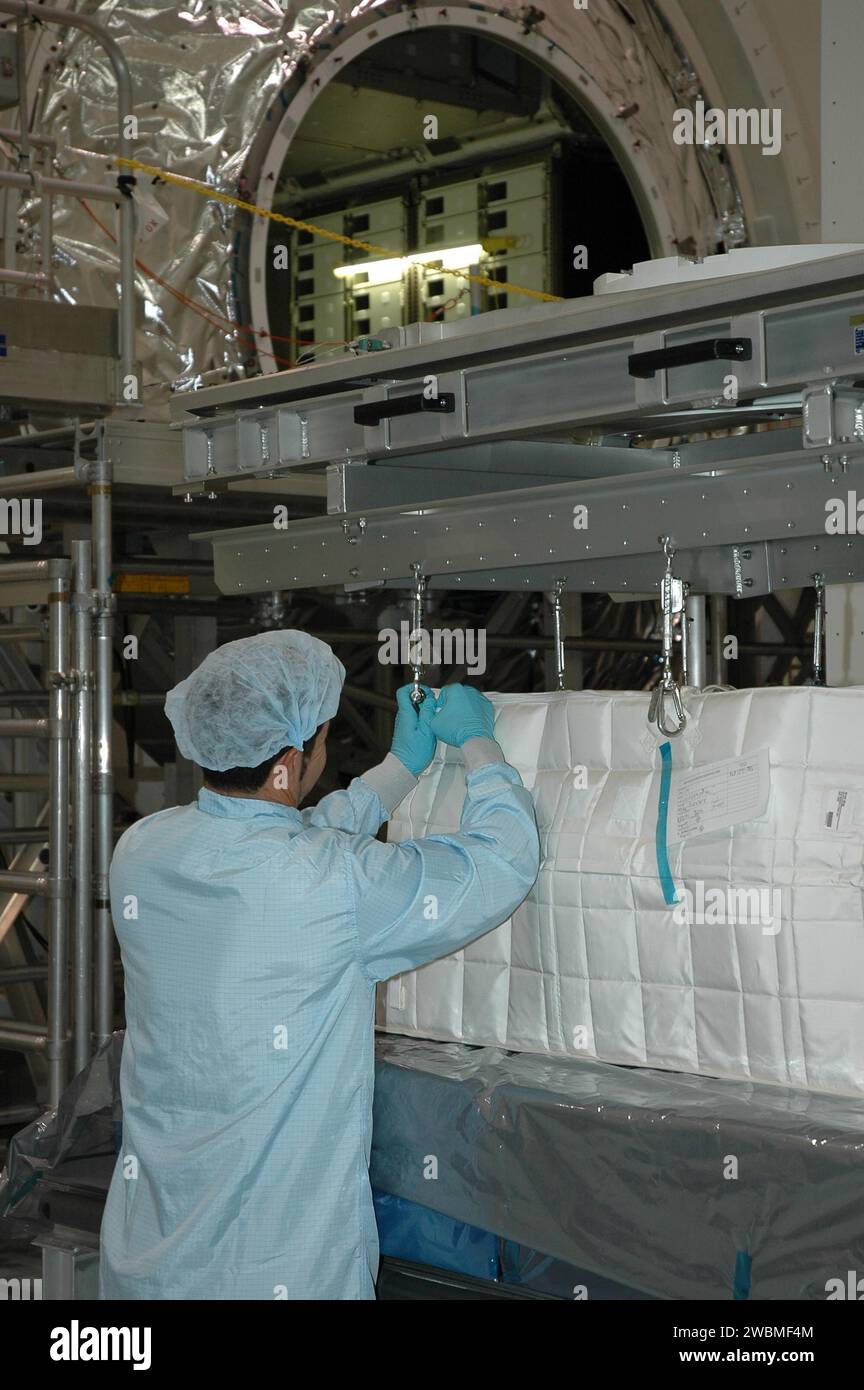 At Kennedy Space Center’s Space Station Processing Facility, a worker ...