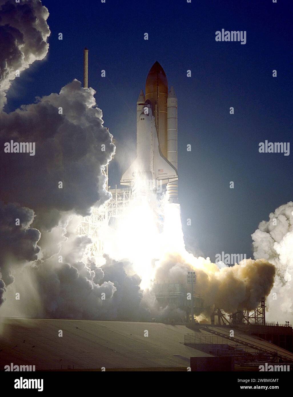 KENNEDY SPACE CENTER, Fla. -- Clouds of smoke and steam billow out from ...