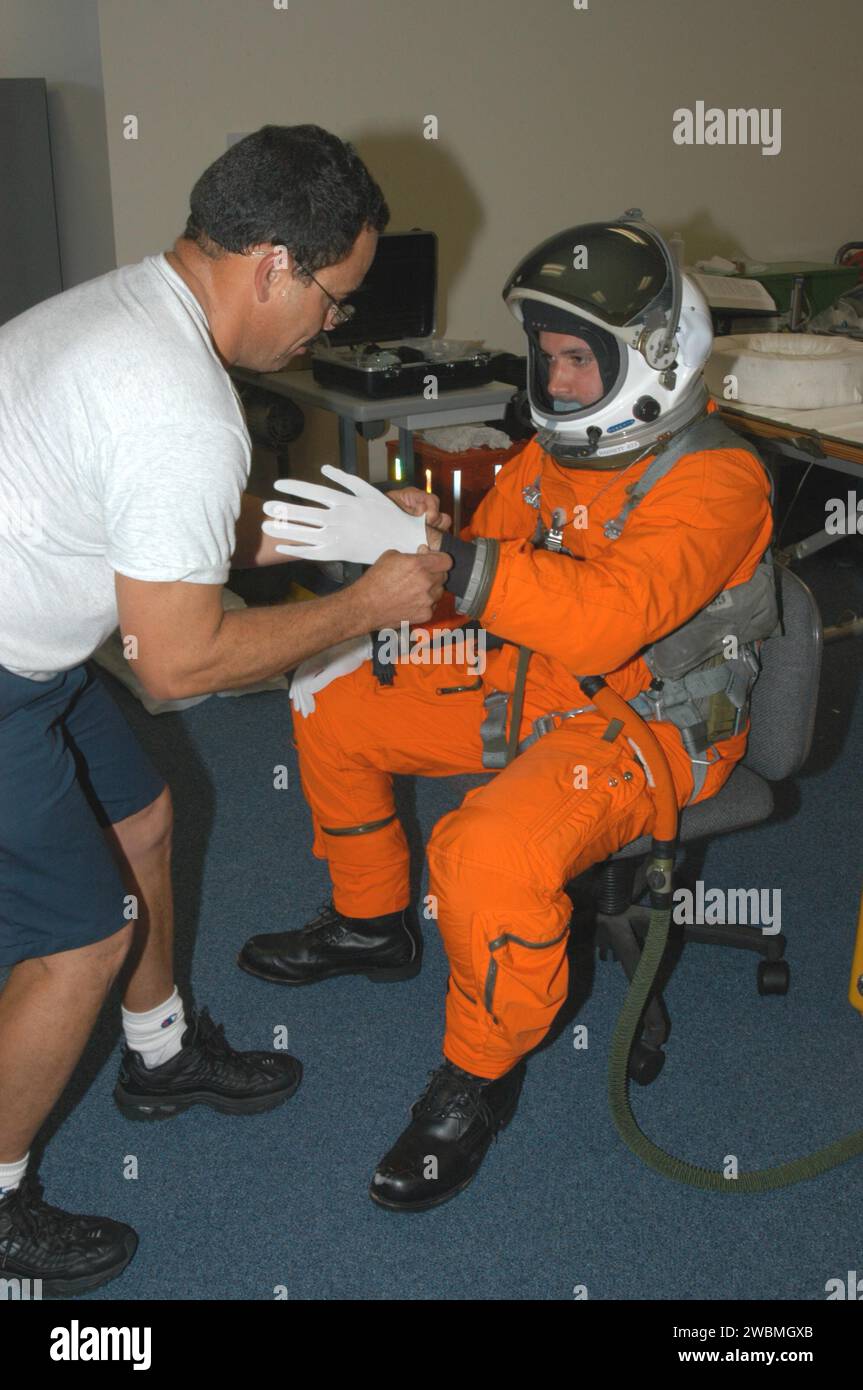 KENNEDY SPACE CENTER, FLA. - NASA aerospace engineer Brian Barnett puts ...