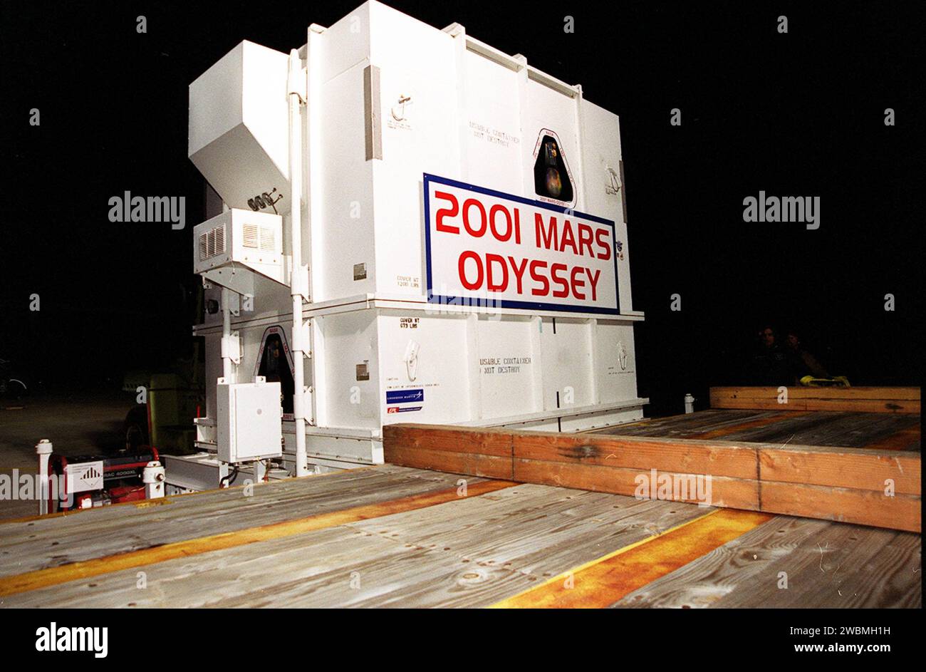 The 2001 Mars Odyssey spacecraft sits on the bed of the trailer that ...