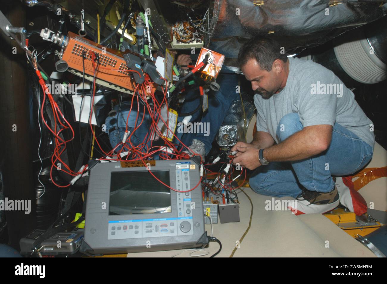 Jack Colella of United Space Alliance conducts electromagnetic ...