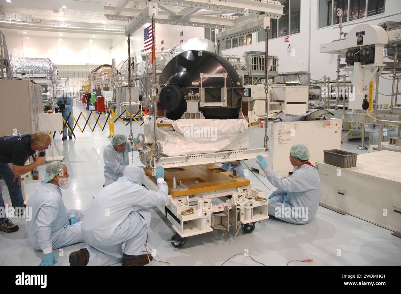 In Kennedy Space Center’s Space Station Processing Facility, workers ...