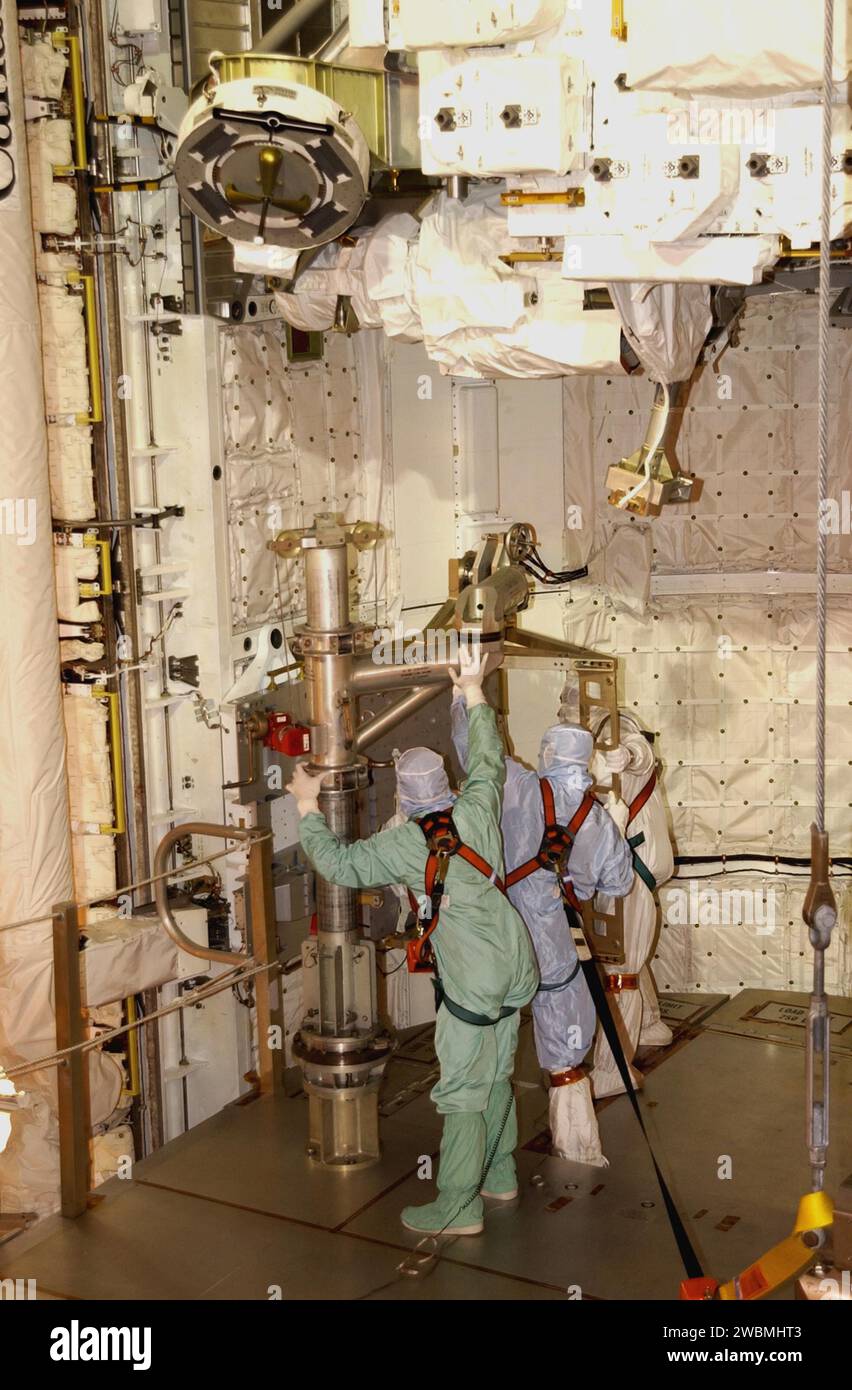 KENNEDY SPACE CENTER, FLA. -- At Pad 39A, technicians install the ...