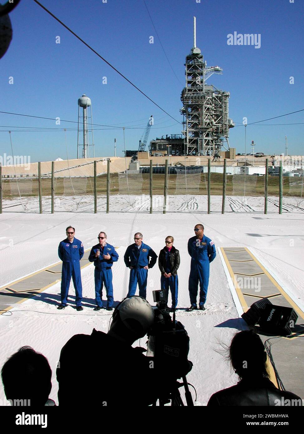 KENNEDY SPACE CENTER, Fla. -- The STS-98 crew gathers at Launch Pad 39A for a media briefing ...