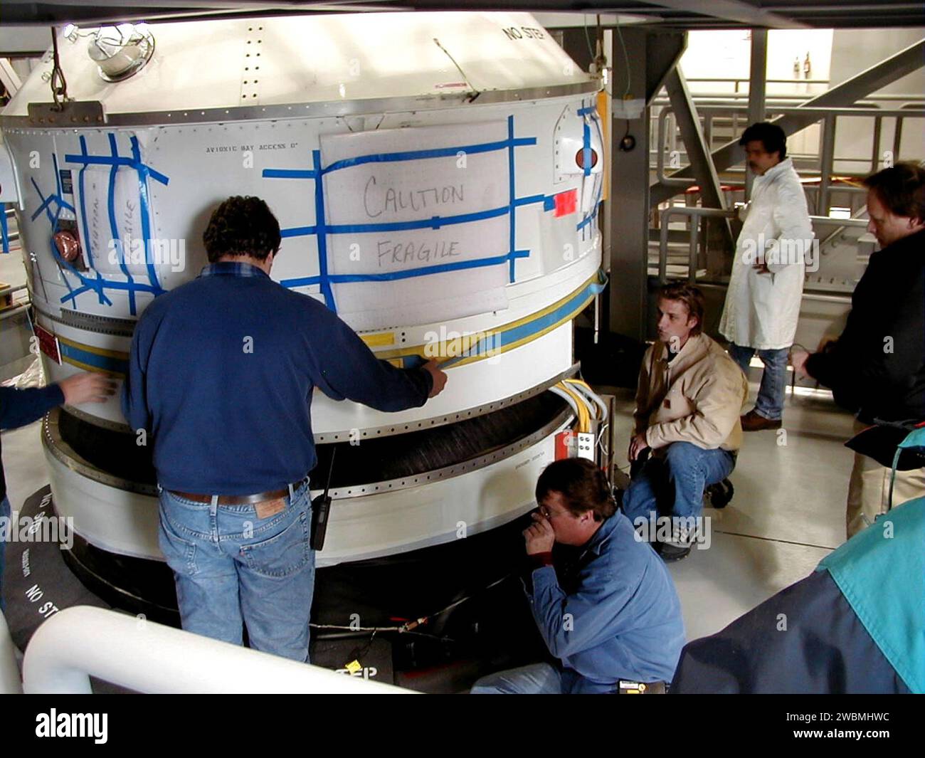 KODIAK ISLAND, Alaska -- Technicians align the fueled Orbit Adjust ...